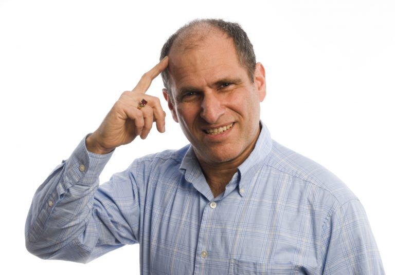 man pointing to head - Retirement Income